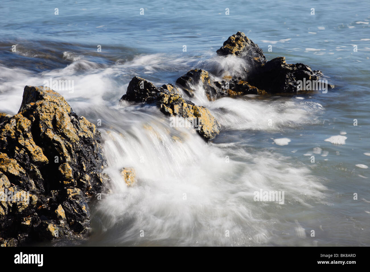 Britain, UK, Europe. Sea water flowing over rocks Stock Photo - Alamy