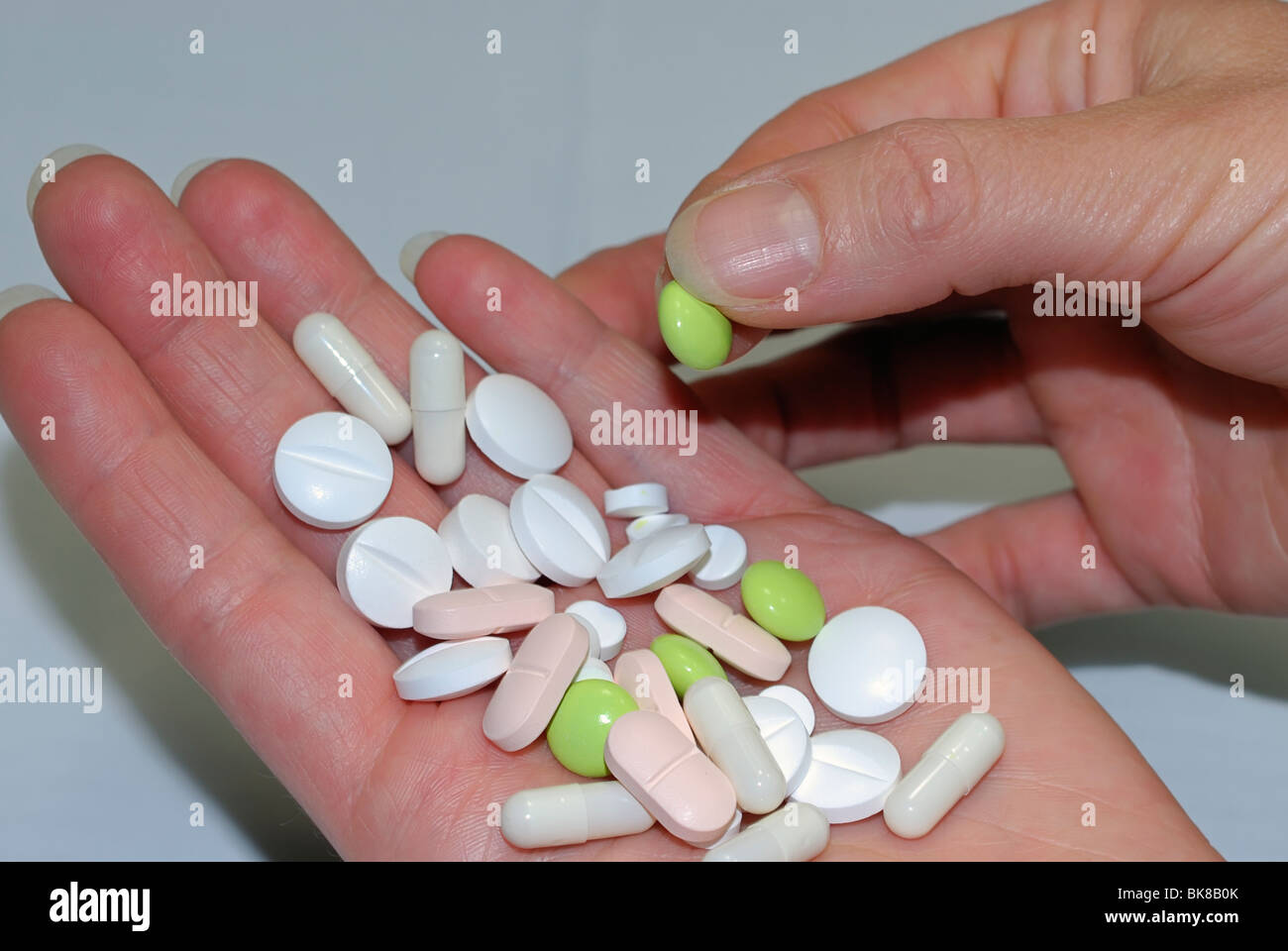 Tablets and pills on a hand Stock Photo - Alamy