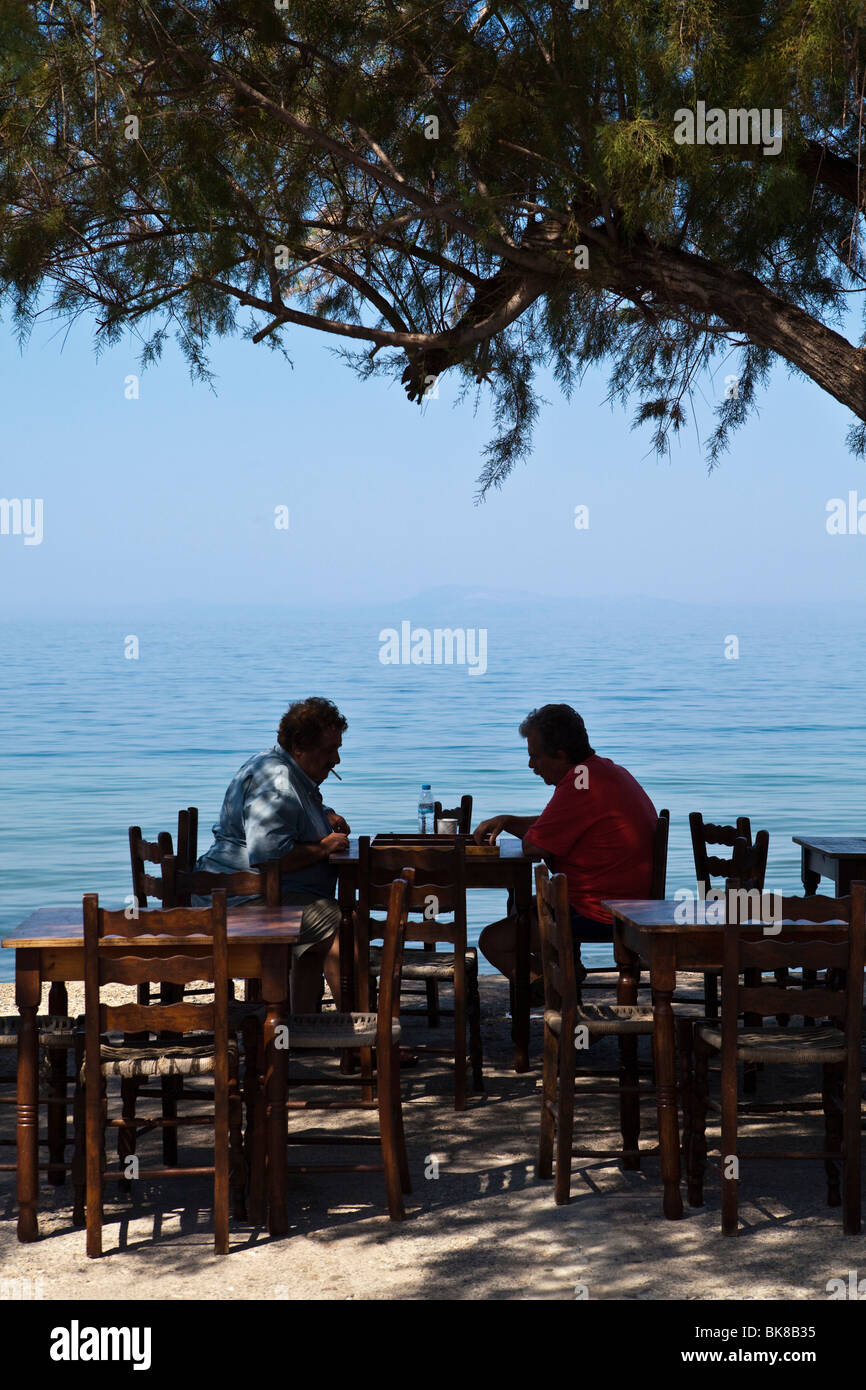 Greeks sitting in a restaurant on the beach, Melina, Greece, Europe ...