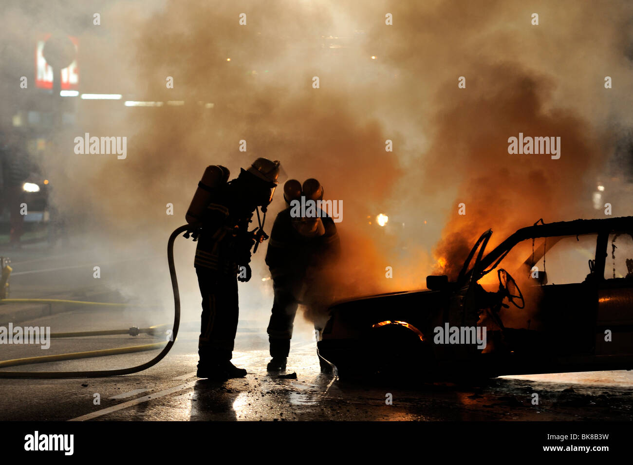 Firefighter scene burning car hi-res stock photography and images - Alamy