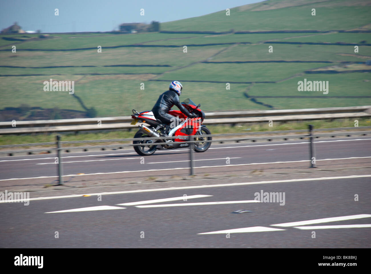 Biker on the M62 motorway (near Outlane, Huddersfield Stock Photo - Alamy