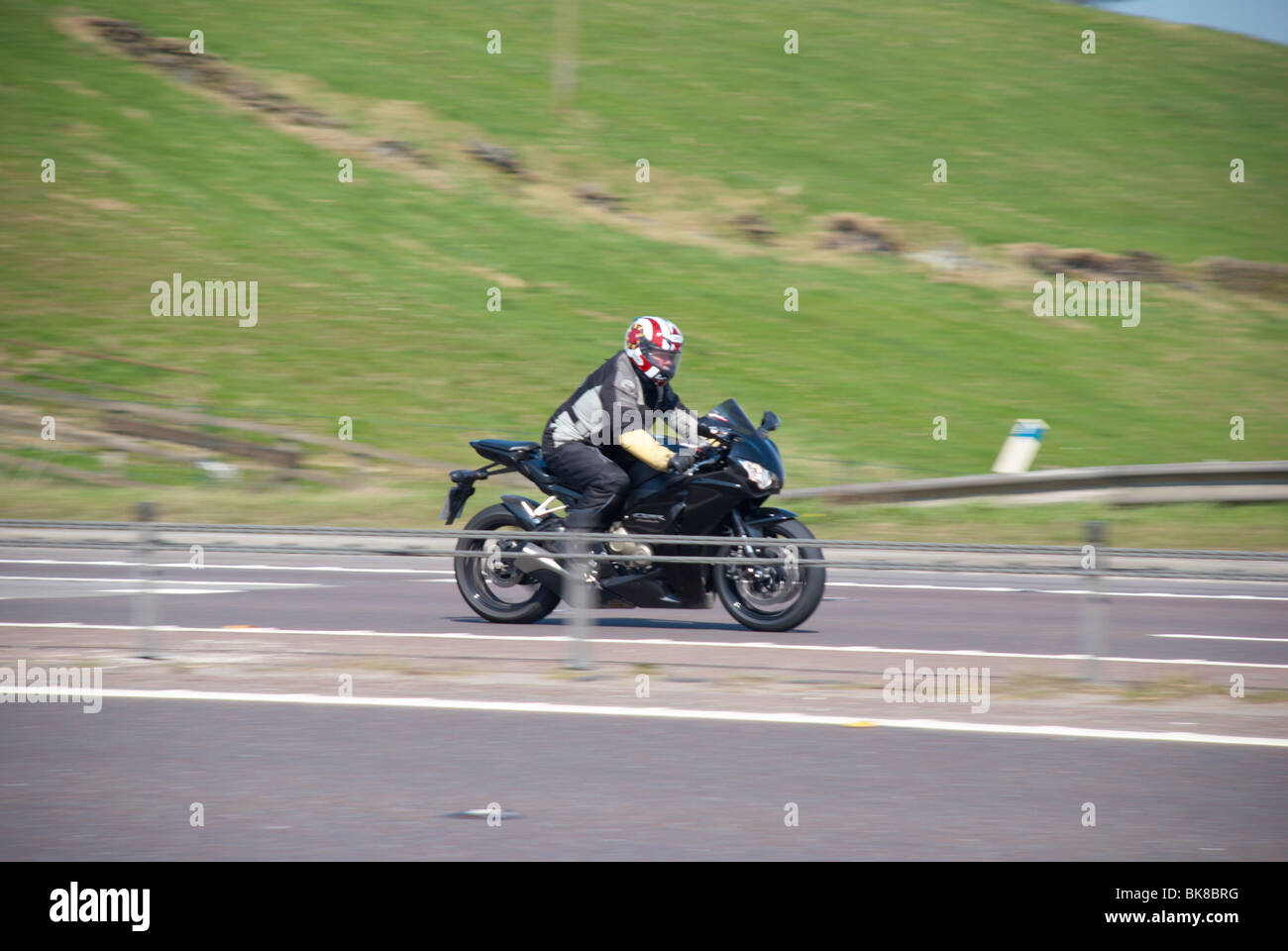 Biker on the M62 motorway (near Outlane, Huddersfield Stock Photo - Alamy