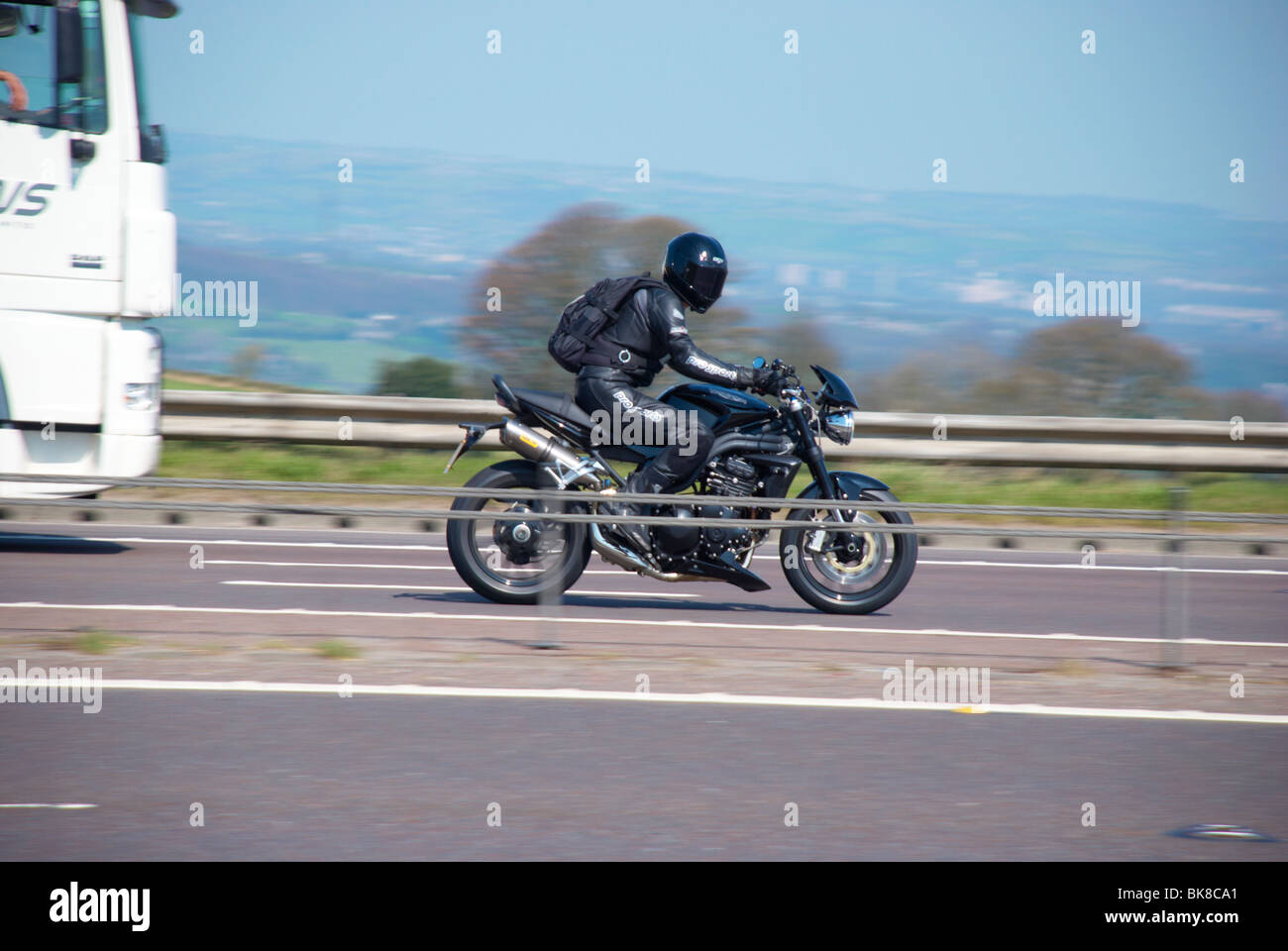 Biker on the M62 motorway (near Outlane, Huddersfield Stock Photo - Alamy