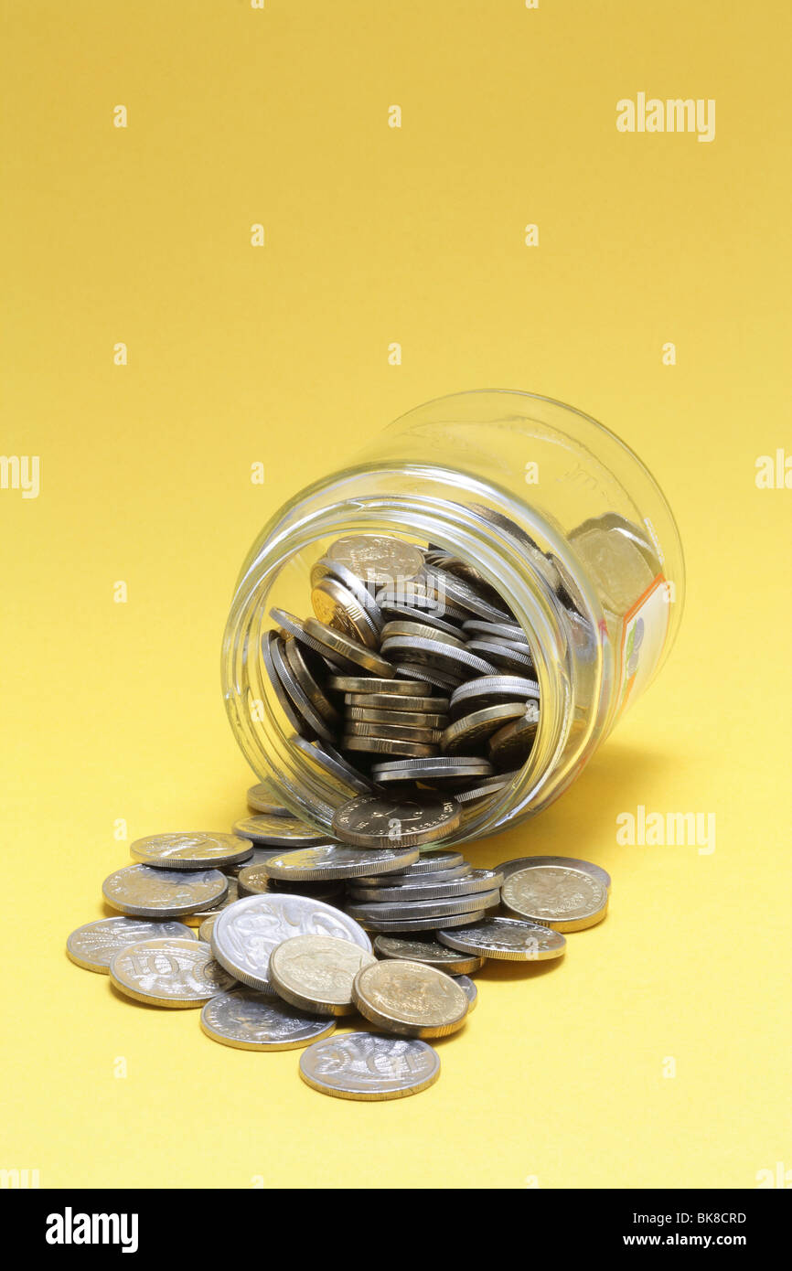 Glass Jar with Coins Stock Photo - Alamy
