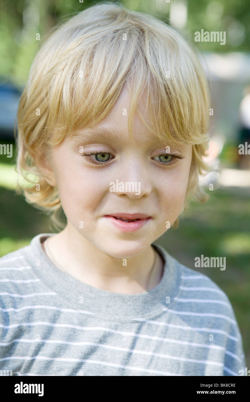 little cute angry girl lying on belly Stock Photo - Alamy