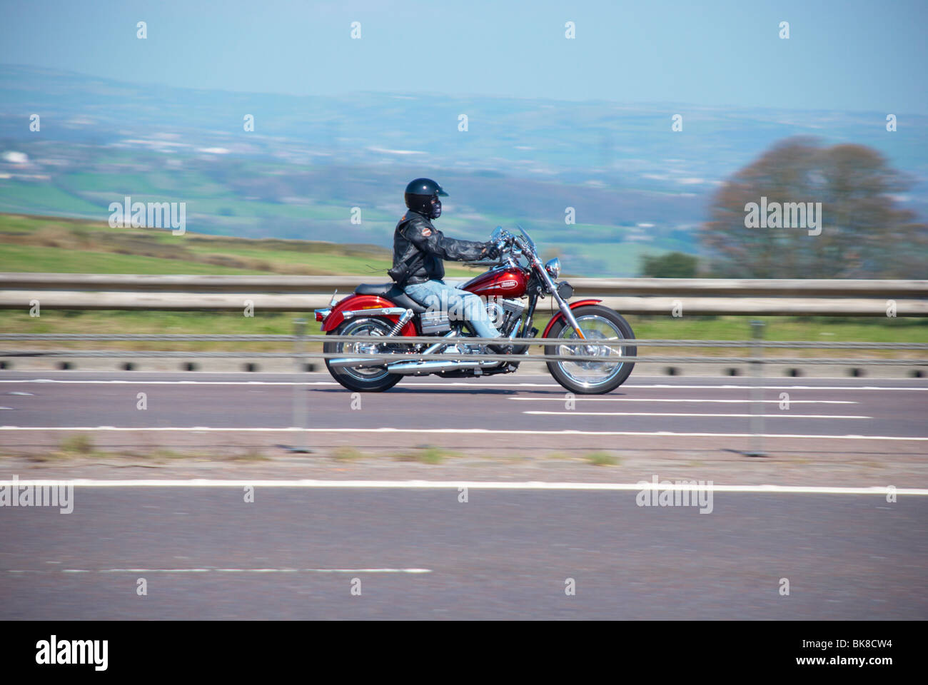 Biker on the M62 motorway (near Outlane, Huddersfield Stock Photo - Alamy