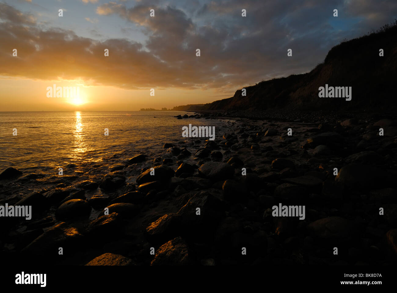 Sunrise on the beach, natural beach on Buelk Lighthouse, Kiel Bay ...