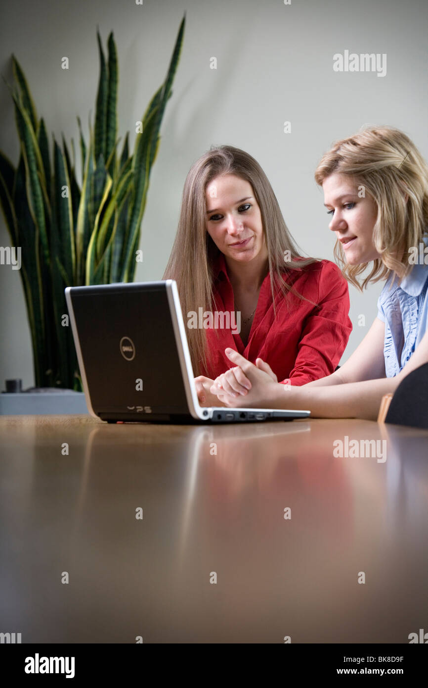 Two people discuss business in a conference room Stock Photo - Alamy