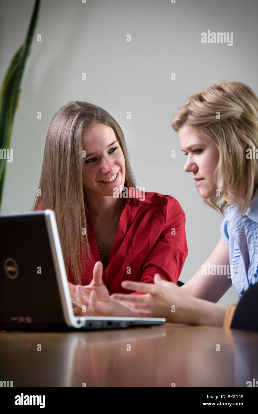 Two people discuss business in a conference room Stock Photo - Alamy