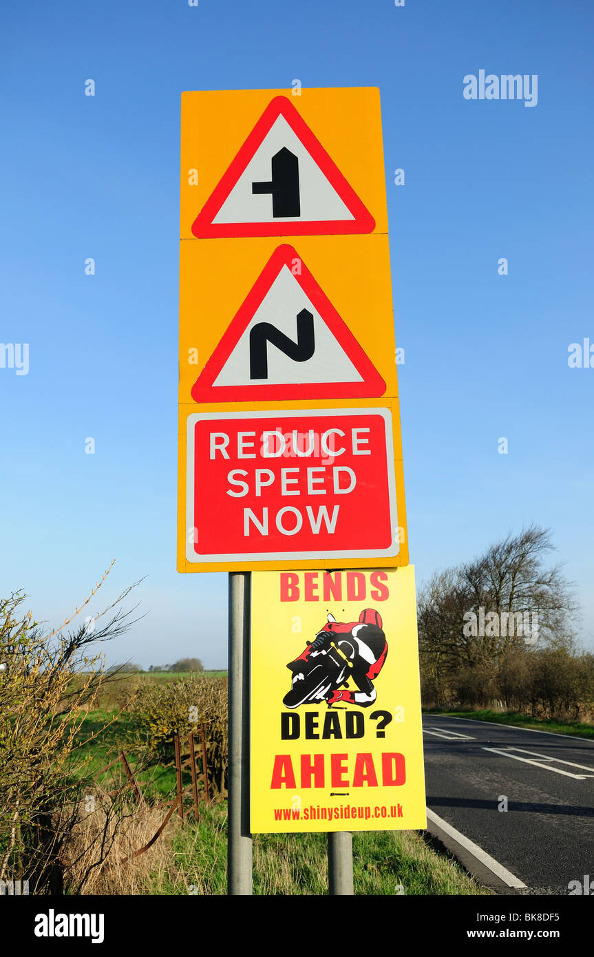 British Road sign Warning Bends Ahead and Junction Stock Photo - Alamy