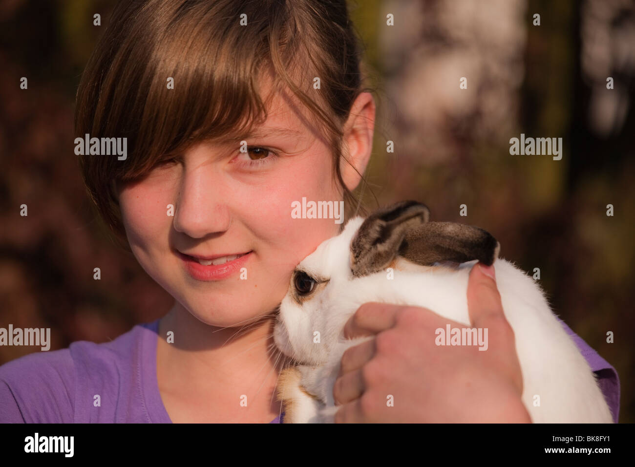 Young girl with a rabbit Stock Photo - Alamy