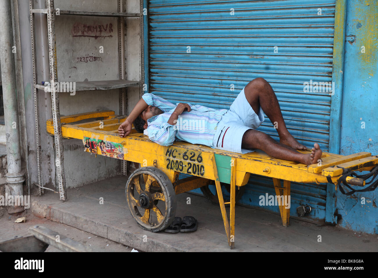 A man having a nap at the spice market in Delhi Stock Photo - Alamy