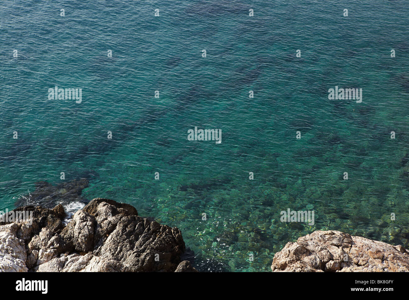 Clear turquoise water and coastal rock background from the Aegean coast ...