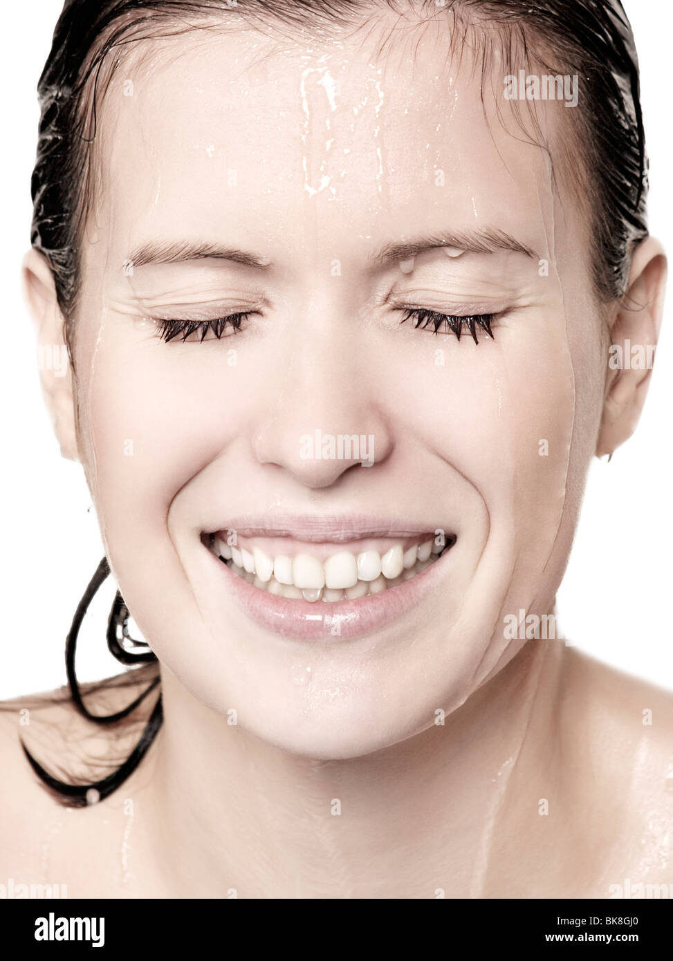 Young woman with water drops on her face Stock Photo - Alamy