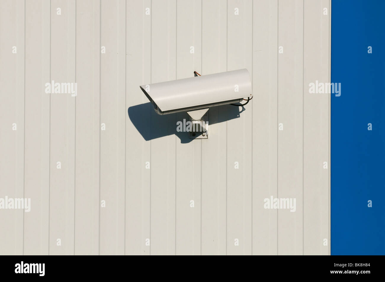 Surveillance camera on hall wall Stock Photo - Alamy