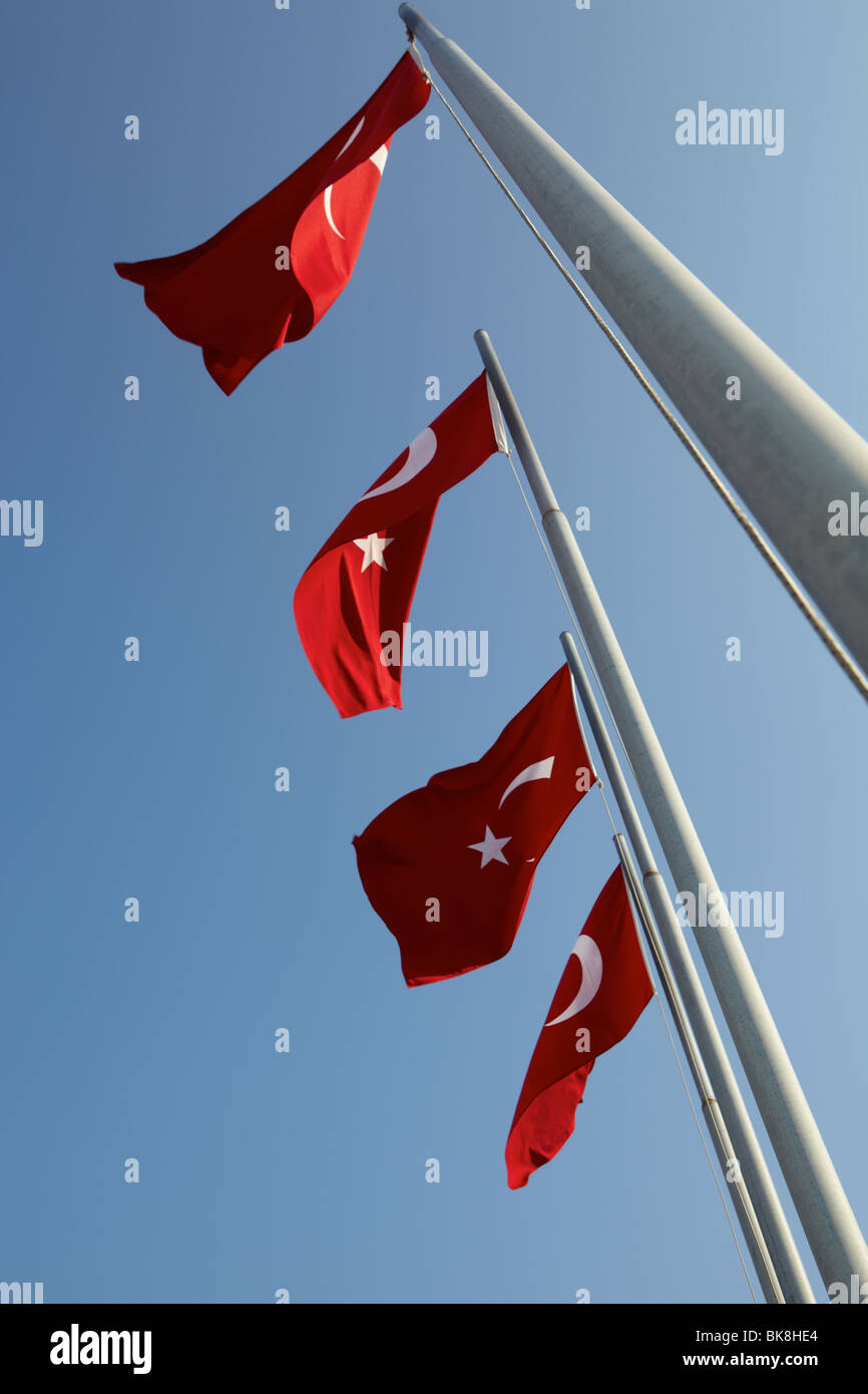 Red turkish flags blowing in the wind on a clear blue sky day Stock ...
