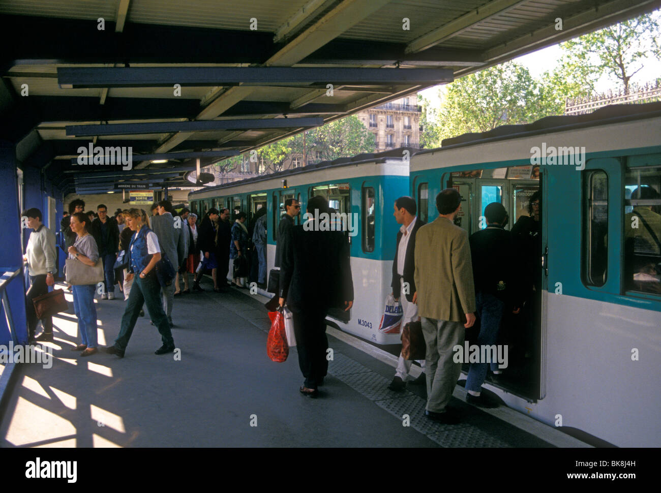 French people person passengers boarding getting on off train Bastille ...