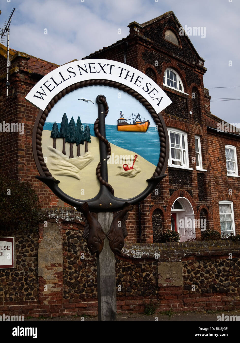 A painted sign for the town of Wells next the Sea Norfolk UK Stock ...