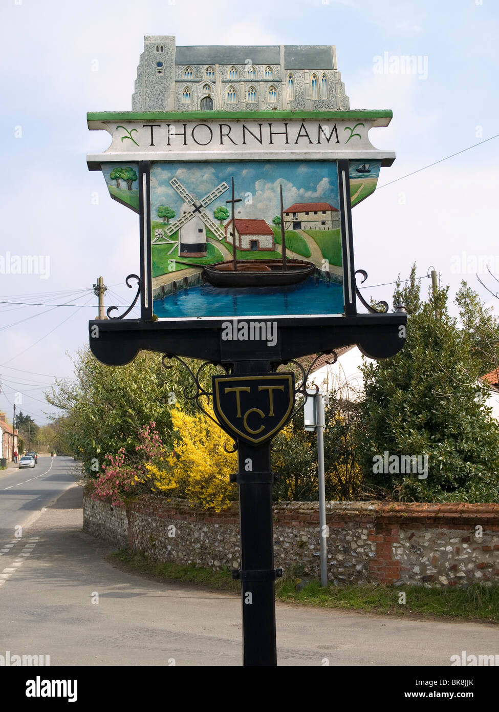 A painted sign for the village of Thornham Norfolk UK, showing a the ...
