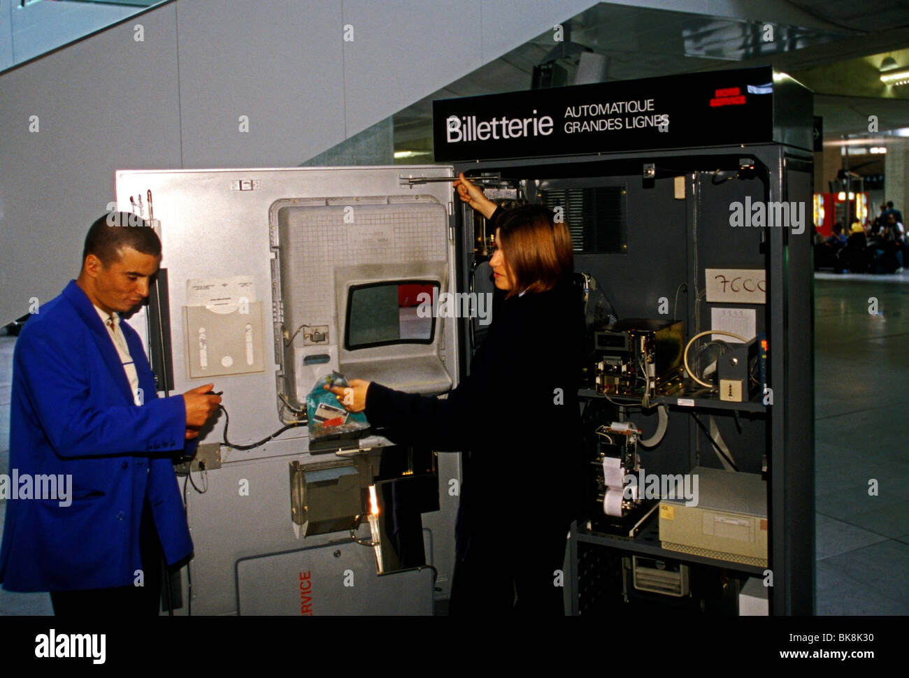 technician repairing automatic ticket machine, billetterie, train ...