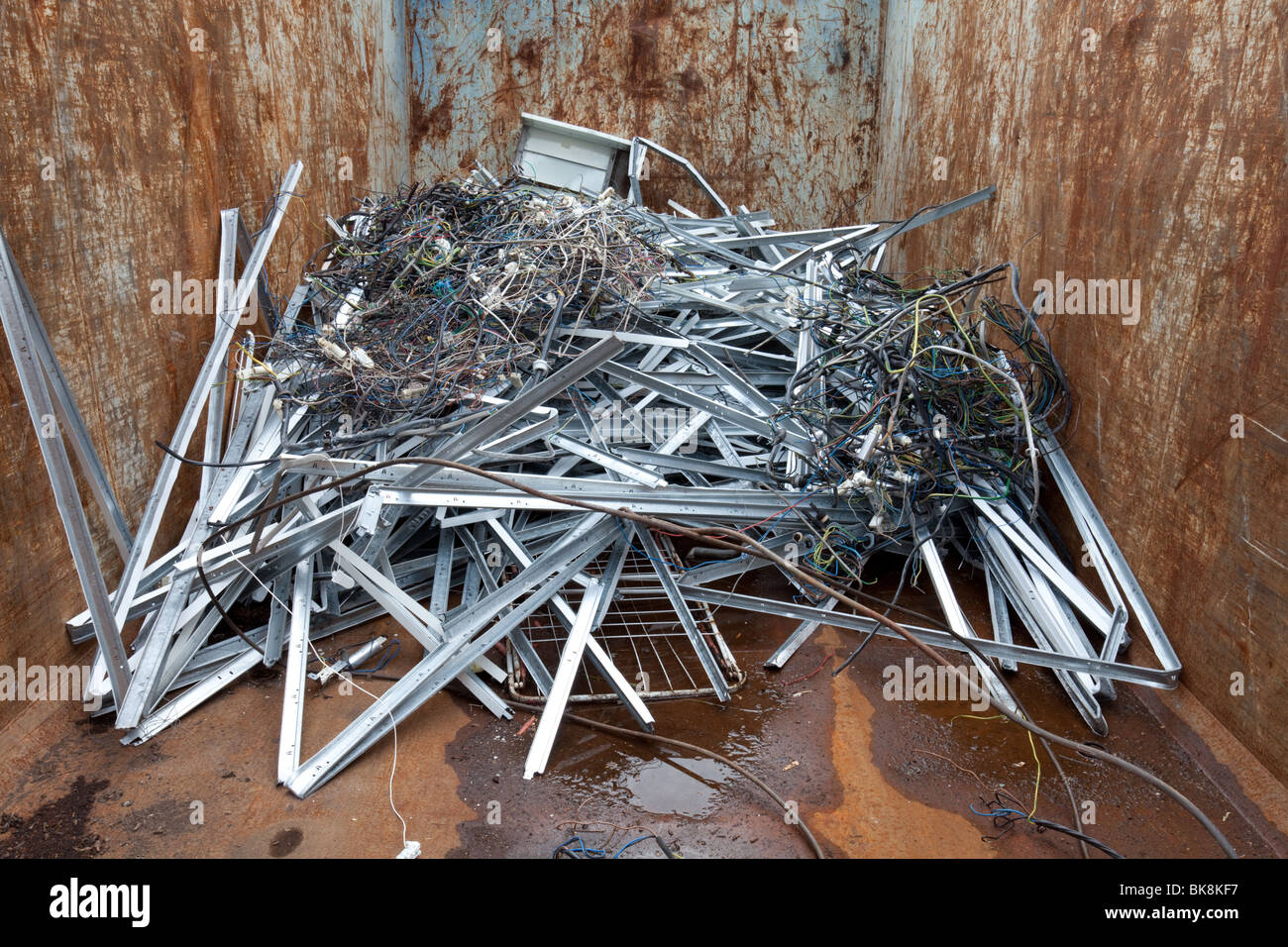 Scrap metal in a rusty container Stock Photo - Alamy