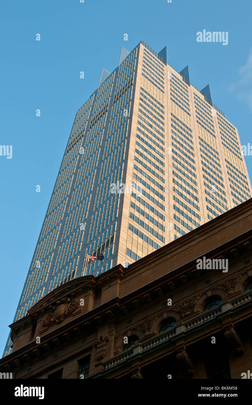 High rise building towering over an old one with the Australian flag ...