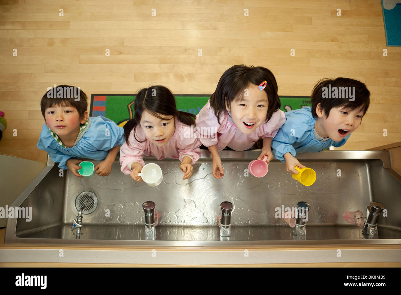 Kindergarten Children Gargling Stock Photo - Alamy