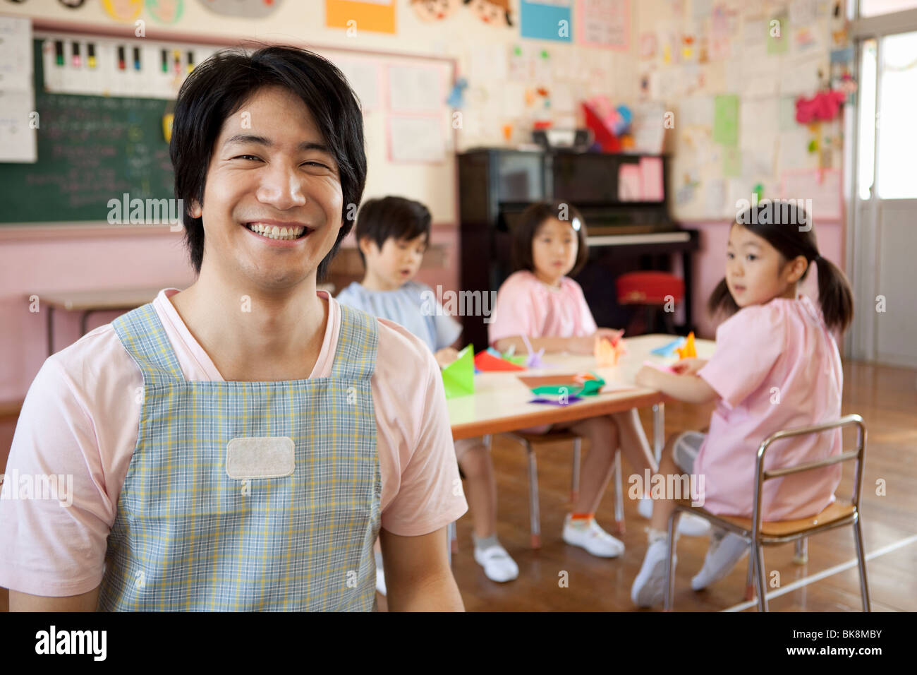 Kindergarten Teacher with Children Stock Photo - Alamy