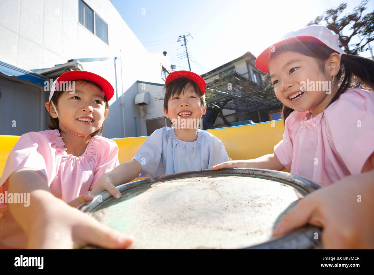 Kindergarten Children Playing with Play Equipment Stock Photo - Alamy