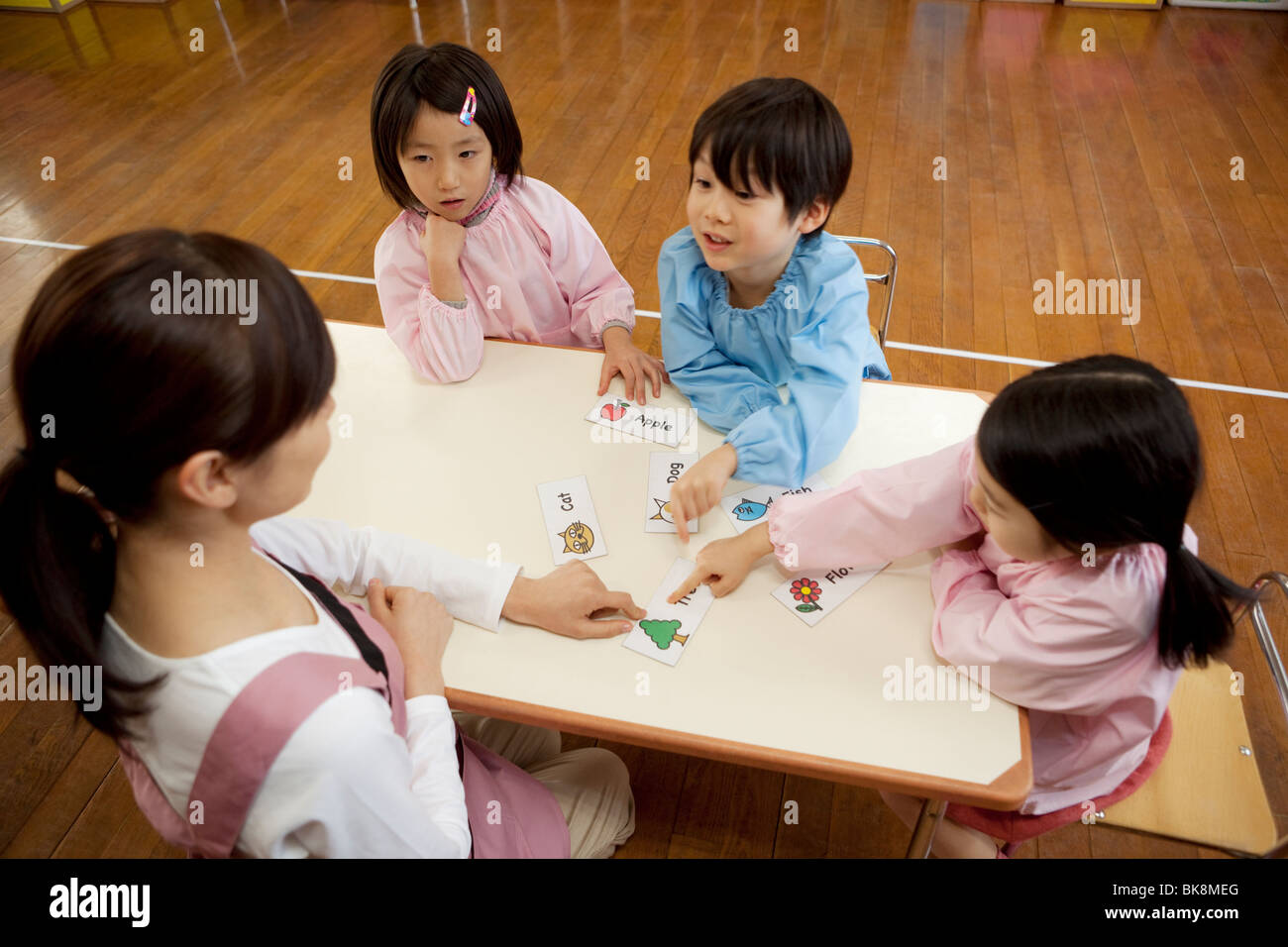 Kindergarten Teacher Teaching Children Stock Photo - Alamy