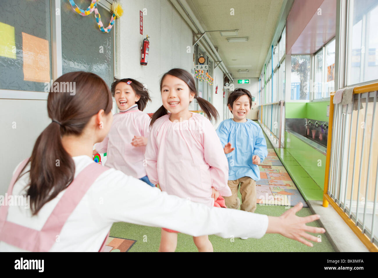 Kindergarten Children Running Hallway Stock Photo - Alamy