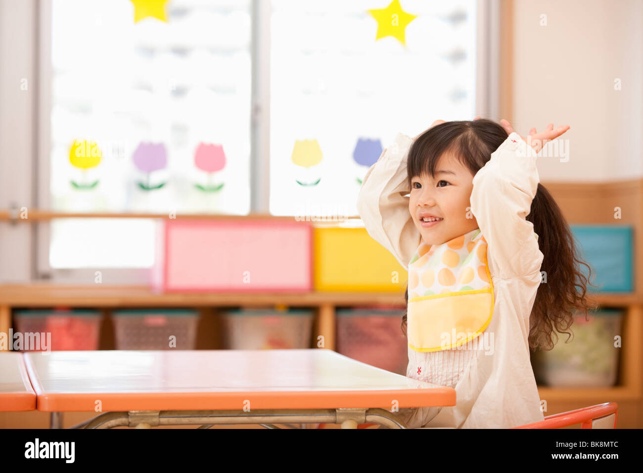 Girl Putting Hands Up Stock Photo - Alamy