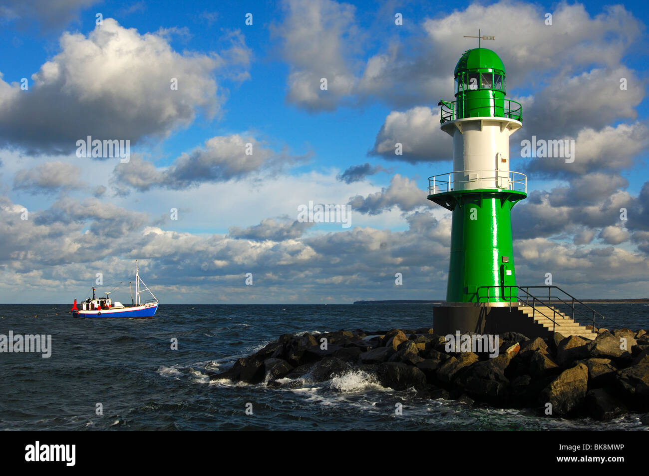 Green-white lighthouse on the mole of Warnemuende, Rostock-Warnemuende ...