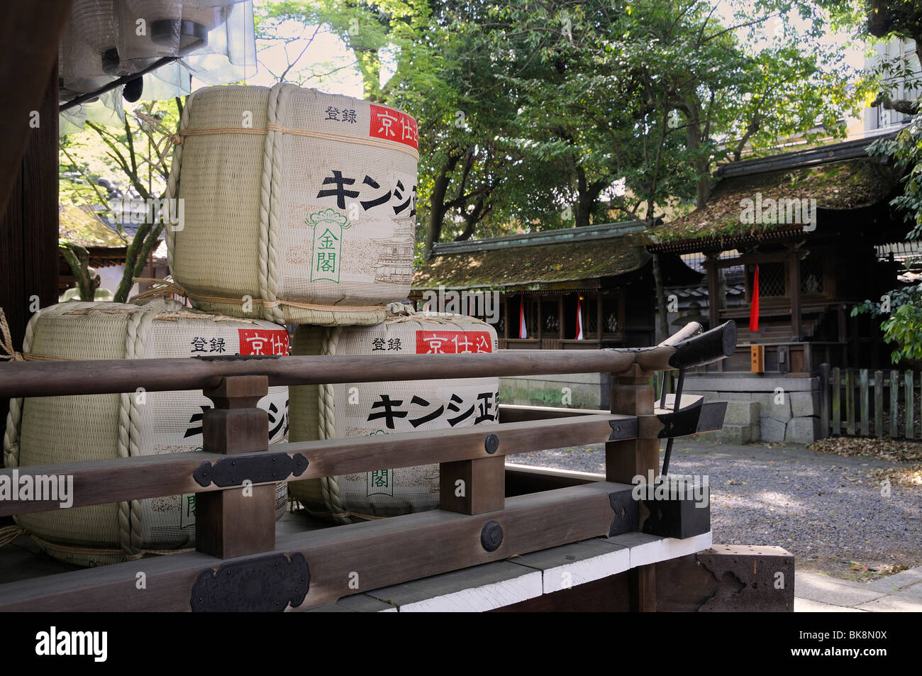 Donated rice wine barrels, sake barrels in a Shinto shrine in the city ...