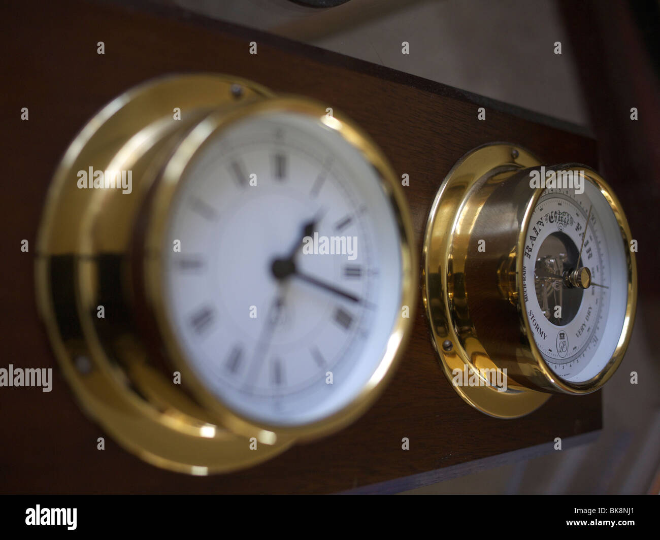 Clock and Barometer on wooden plinth.UK Stock Photo - Alamy