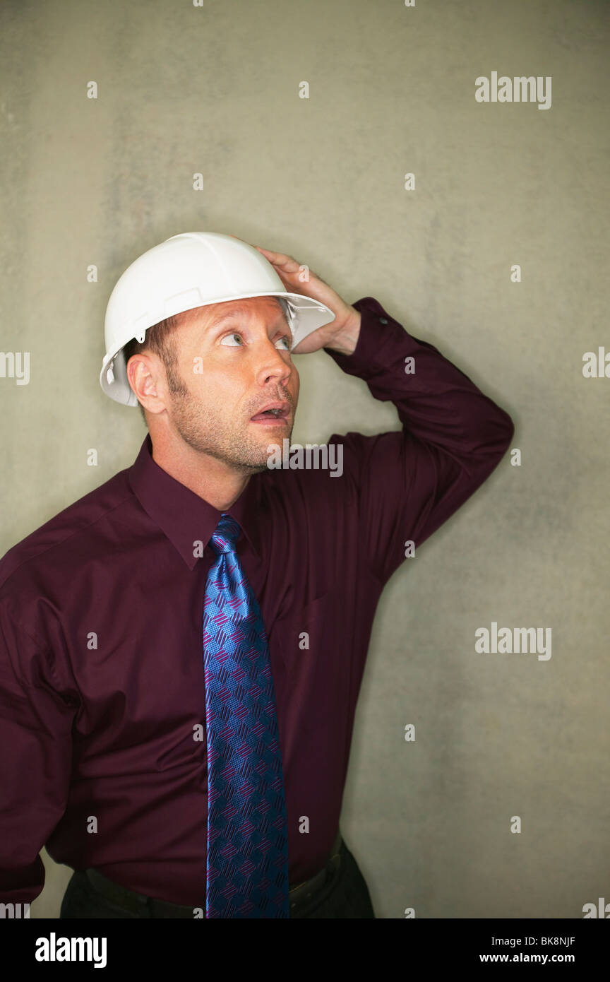 Architect wearing a hard hat Stock Photo - Alamy