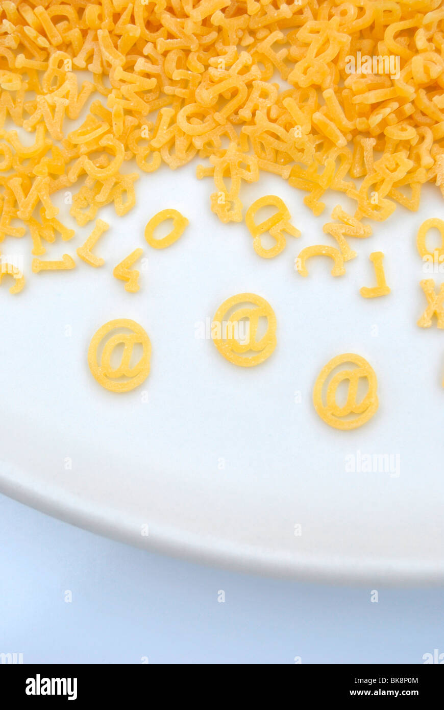 Letters made of pasta with special character @, plate Stock Photo - Alamy