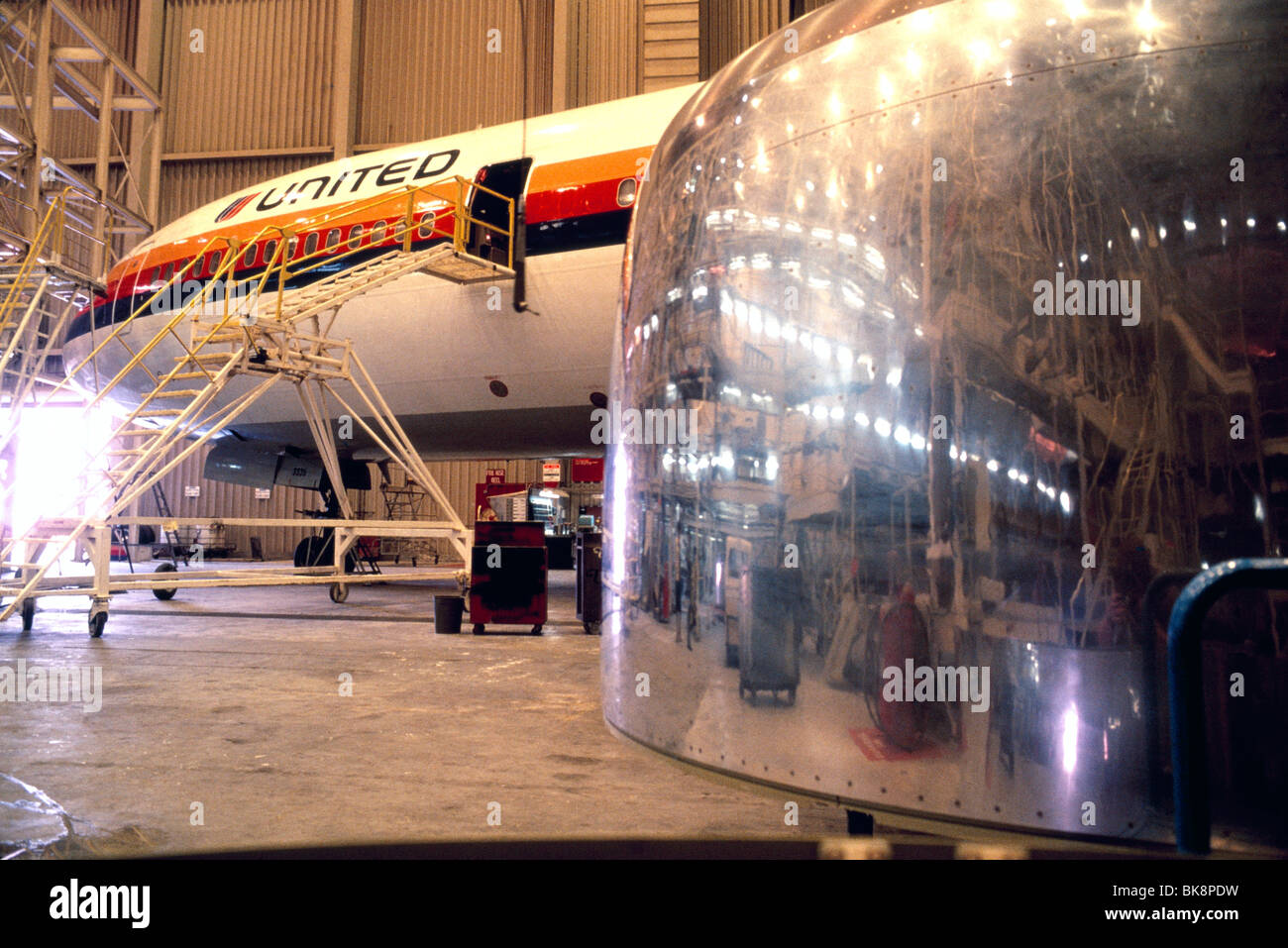 Engine cowling and a jet airliner at the United Airlines maintenance ...