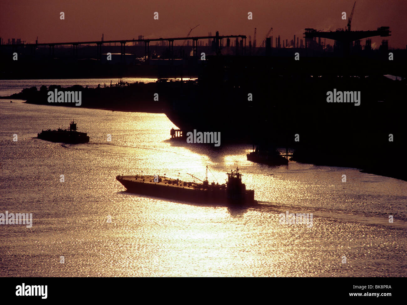 Sunset view of freighter traveling along the Houston Ship Channel near ...