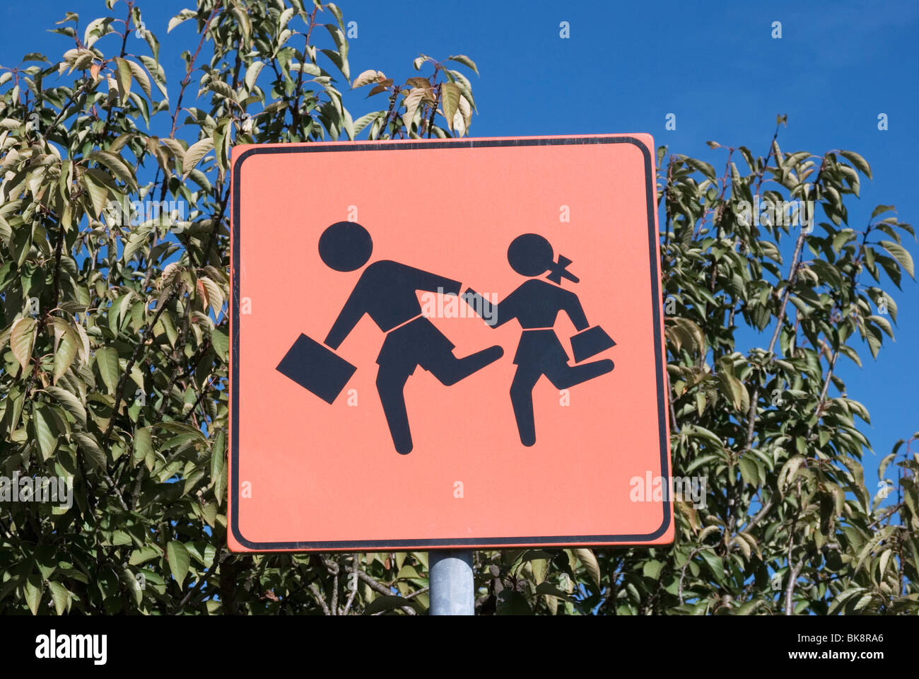 Road traffic sign warning of school children crossing Stock Photo - Alamy