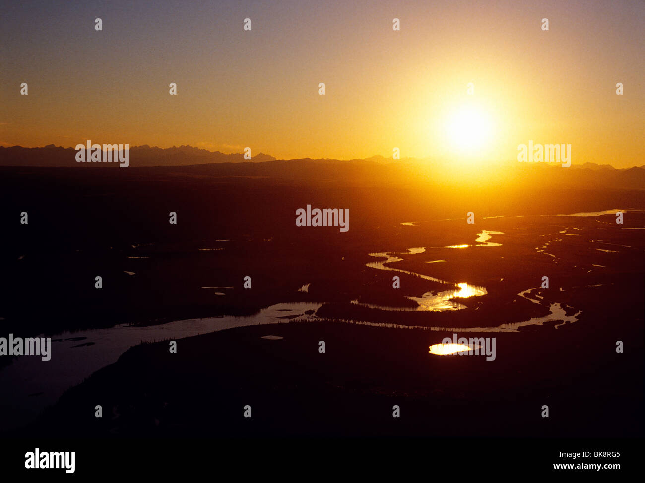 Sunset aerial view of the Yentna River and surrounding tundra ...