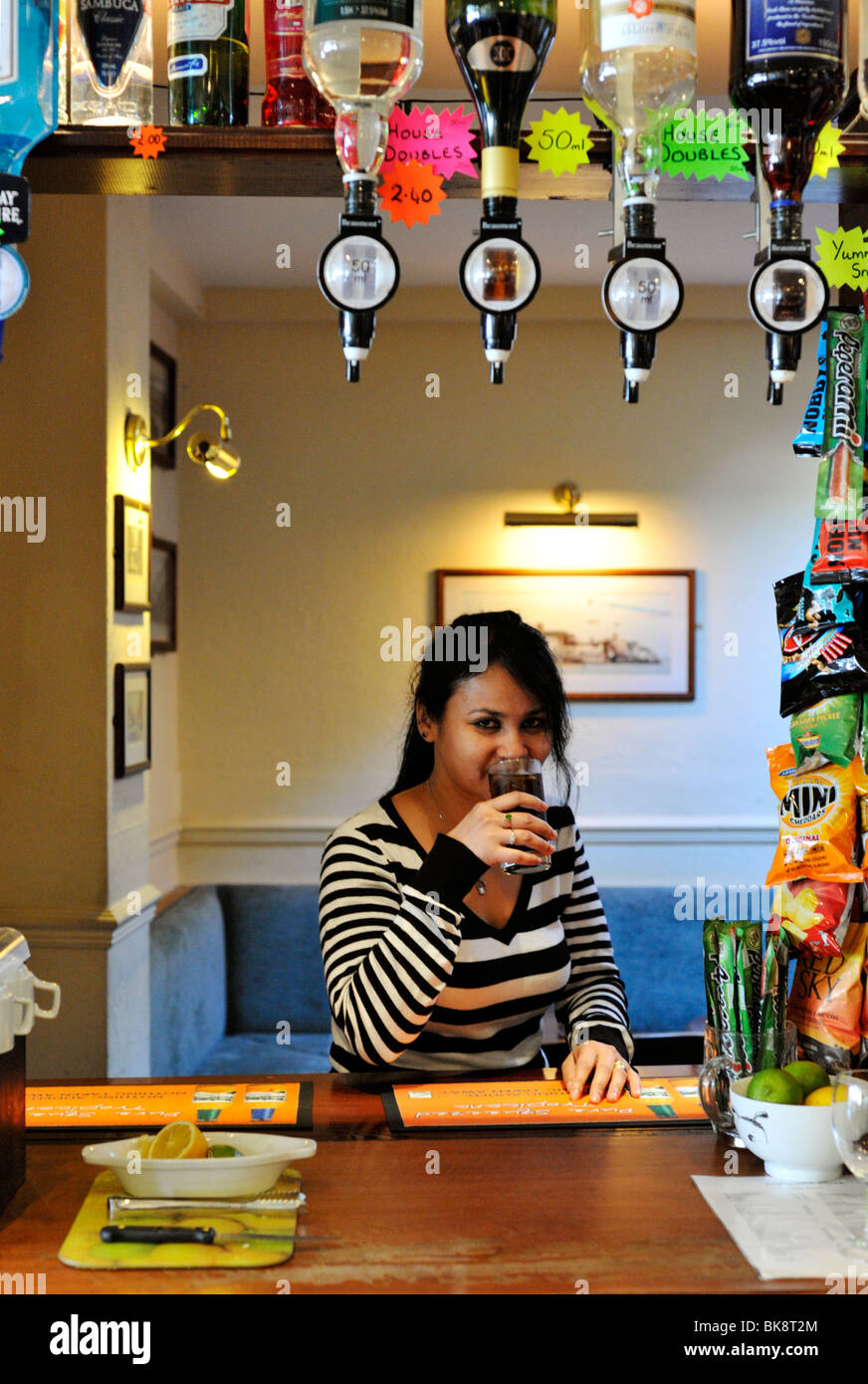 young woman sitting in traditional pub having a drink england Stock ...