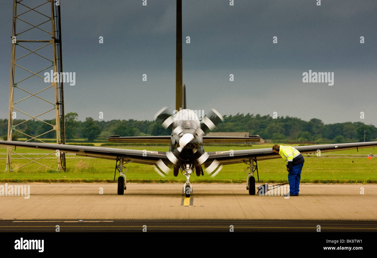 Engineer checking aeroplane as it prepares to take off from RAF Linton ...