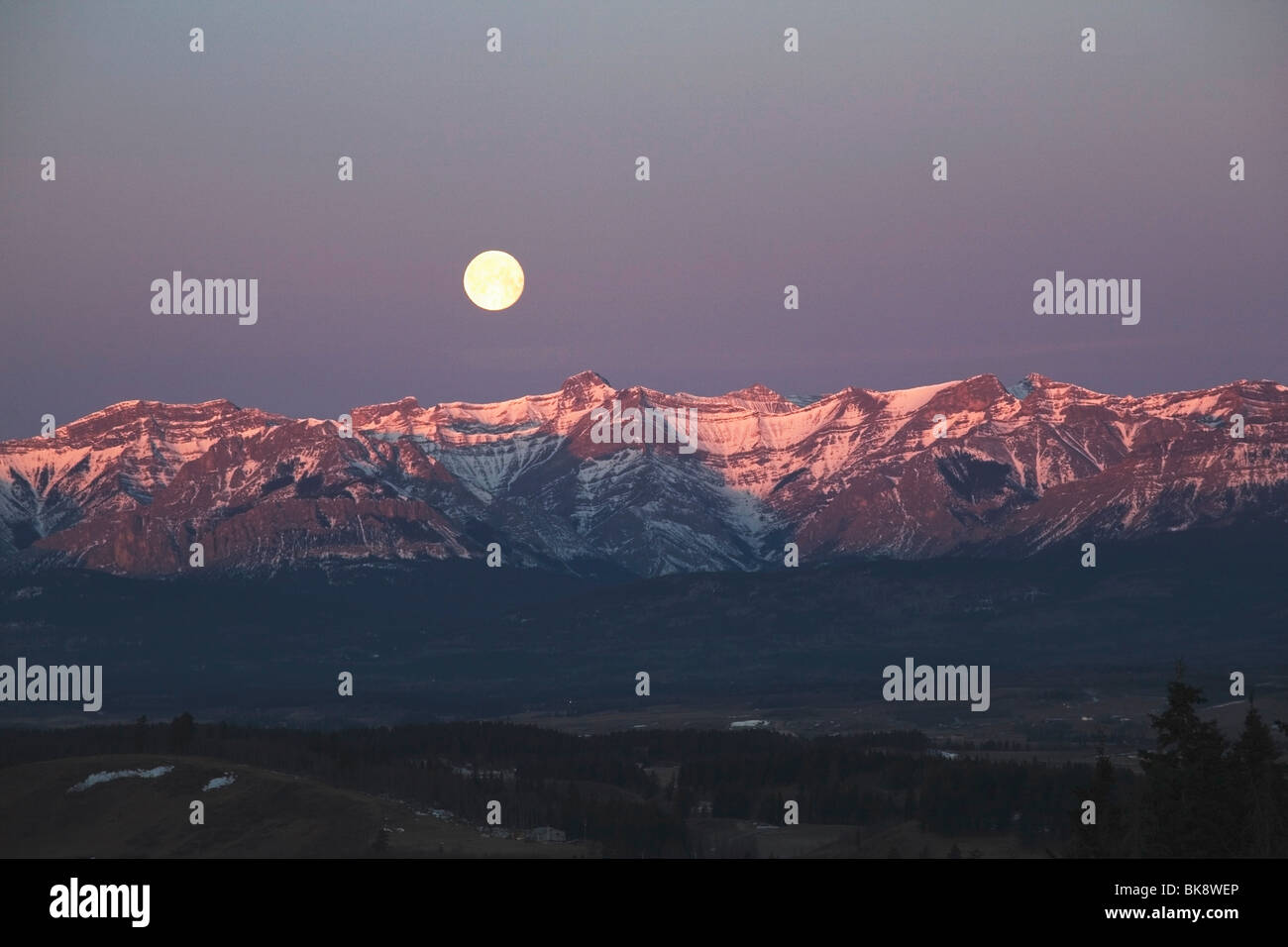 Alberta, Canada; Moon Set Over Front Range Mountains Stock Photo - Alamy