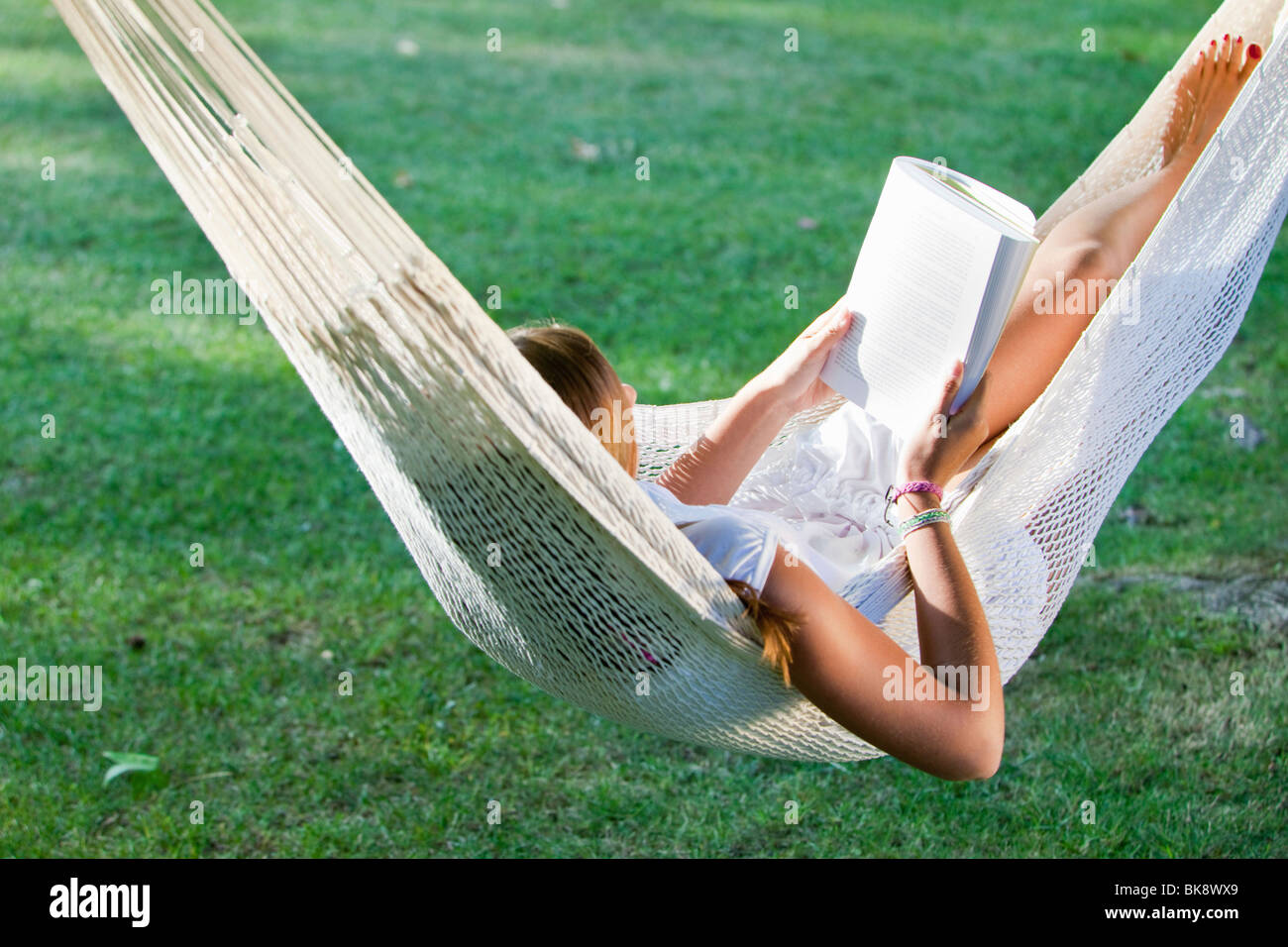 Girl in a hammock Stock Photo - Alamy