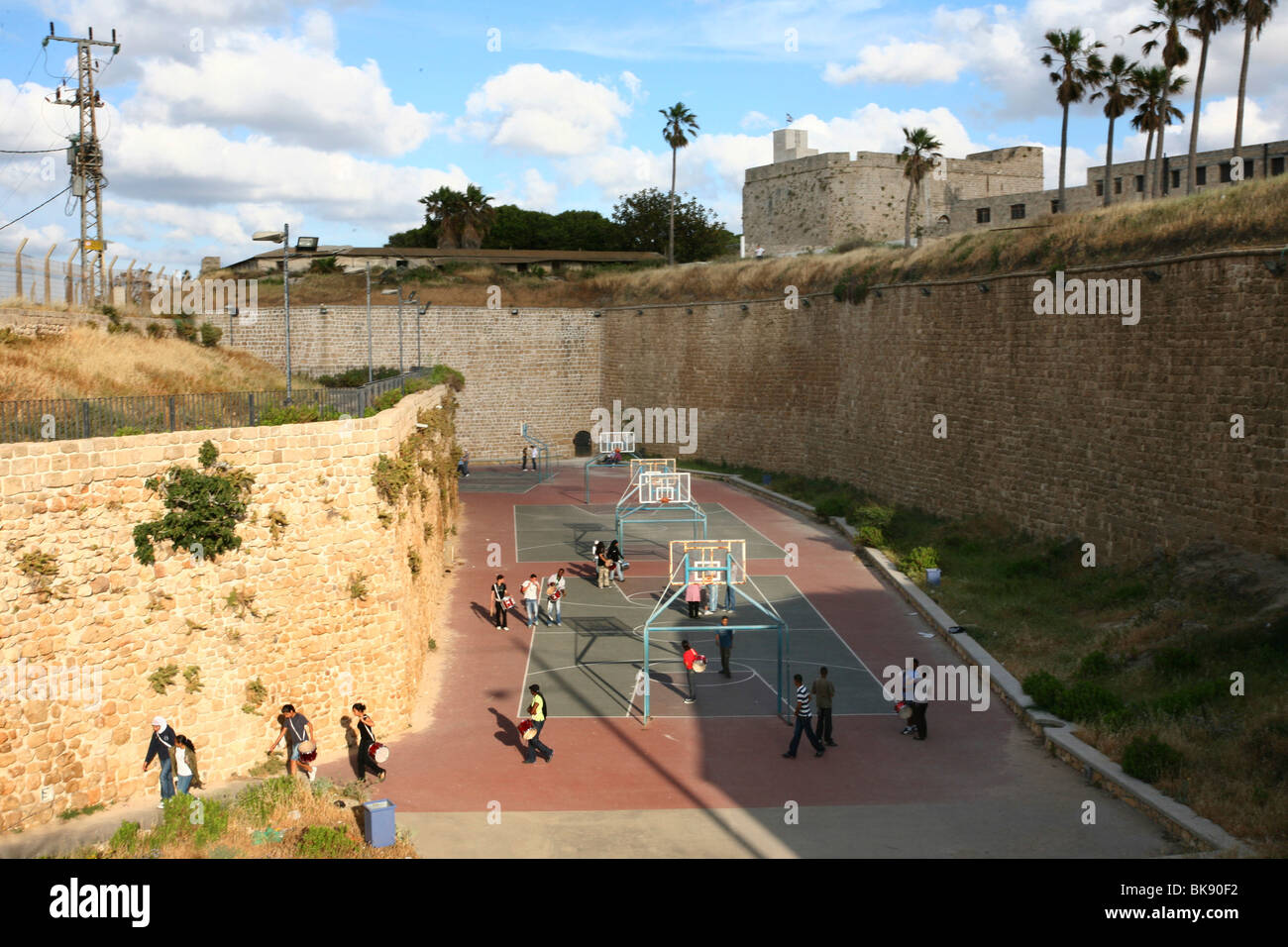 Israel, Acre, Students in a school yard in the moat of the old city ...