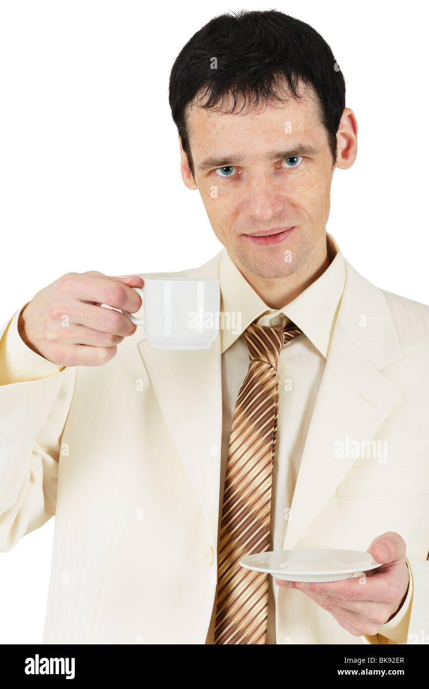 A man dressed in suit drinking tea on a white background Stock Photo ...