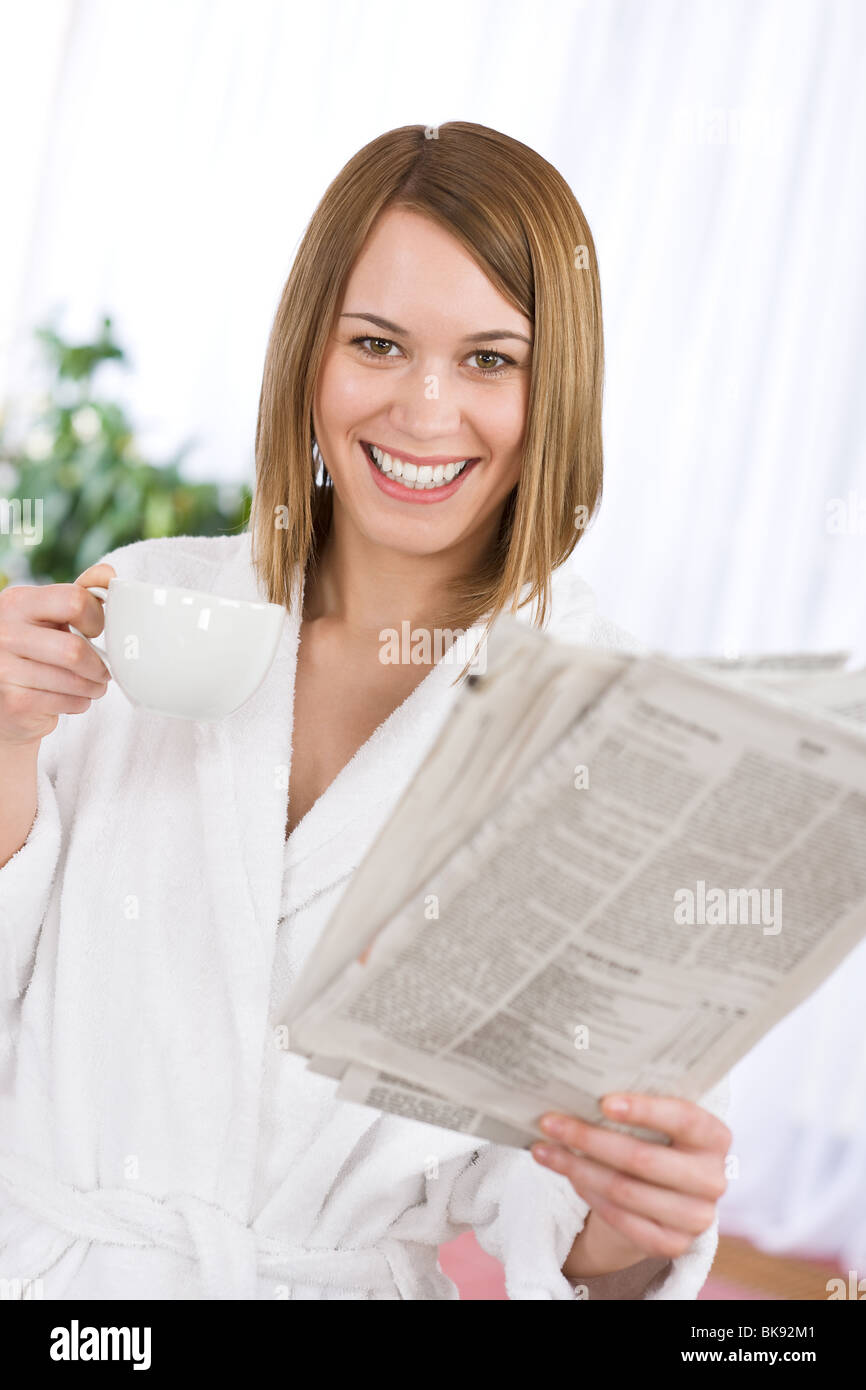 Breakfast - happy woman reading newspaper drink coffee, wearing ...