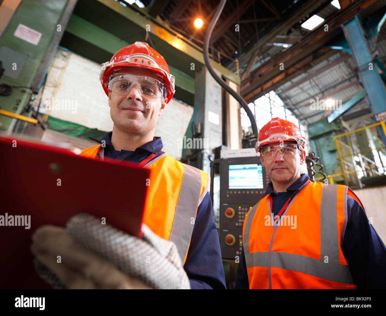 Steel Engineers In Plant With Clipboard Stock Photo - Alamy