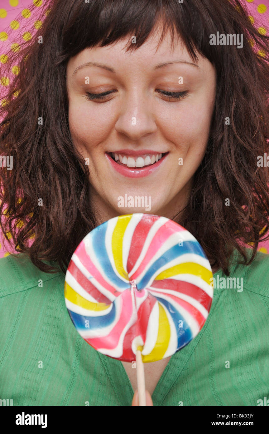 Happy curly woman lollipop hi-res stock photography and images - Alamy